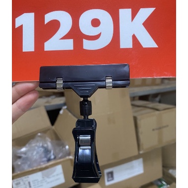 Black mica plastic clip with specialized 2-headed design, used to clamp ...