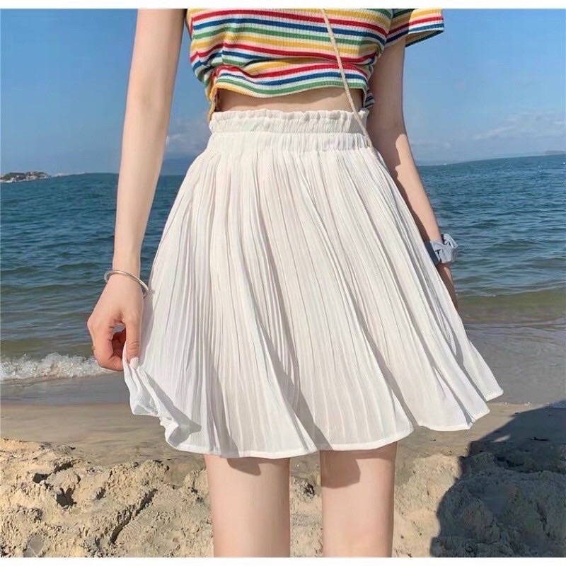 Cute lady's short flared pleated skirt with elastic waist and solid ...