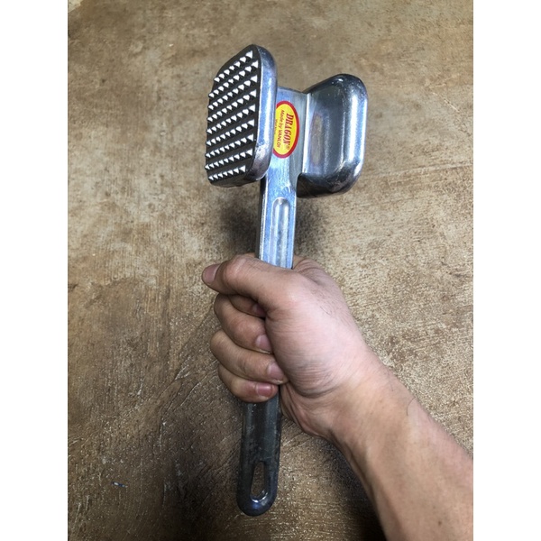 The Meat Hammer Is Smashed On Both Sides Of The Spikes And The Hammer ...