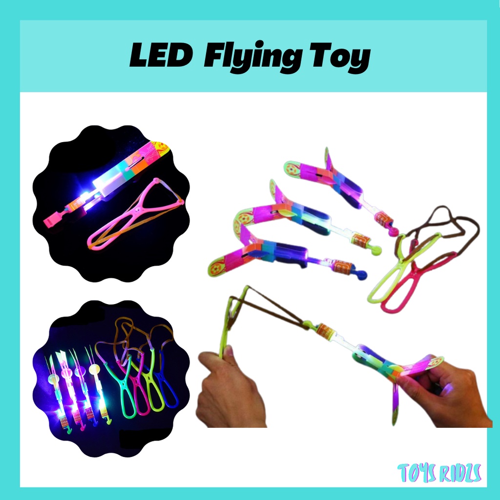 Amazing LED Light Flying Toy Rotating Catapult Helicopter Party Classic ...