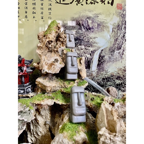 Faux stone statue face decorates miniature rockery, aquarium, semi ...