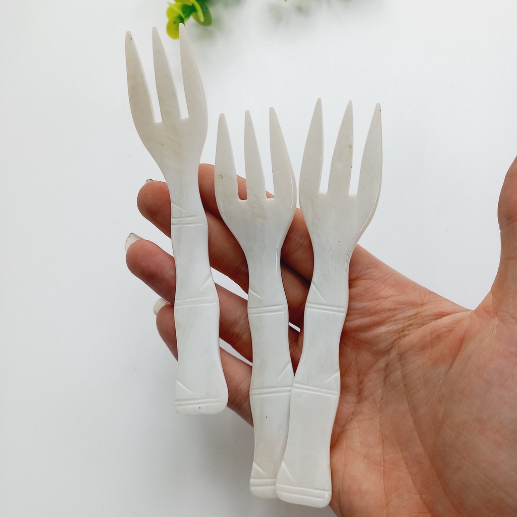 Forks, Plates of White Clams Rolled in the Shape of Coconut Trees for ...