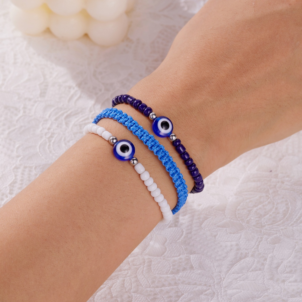 ZHENGYOU The Golden Bead Cross Devil's Eye Bracelet Set is stylishly ...