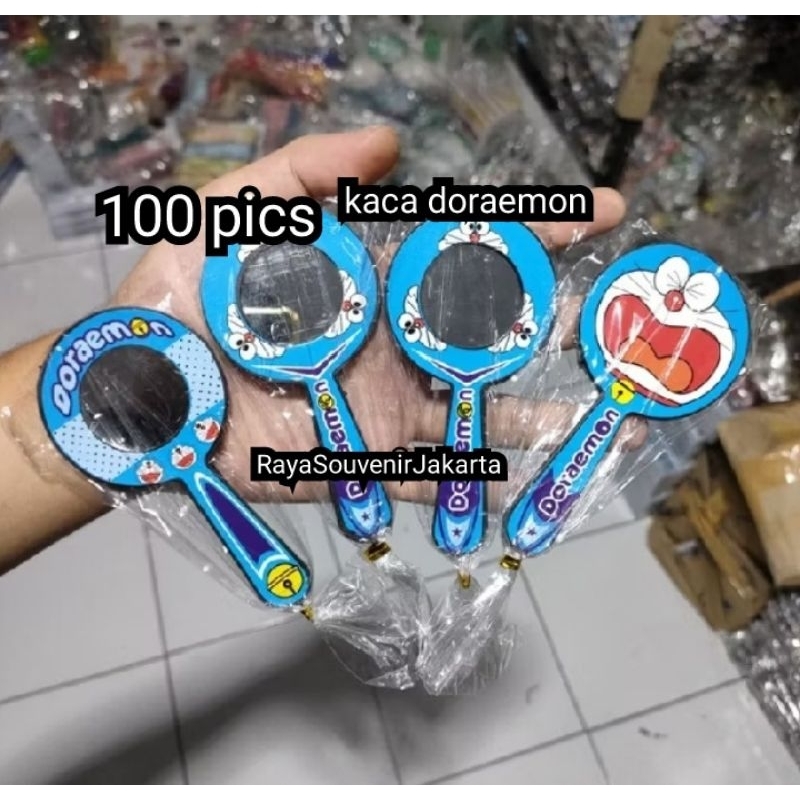 Souvenir contains 100 pics of doraemon glass in plastic packaging ...