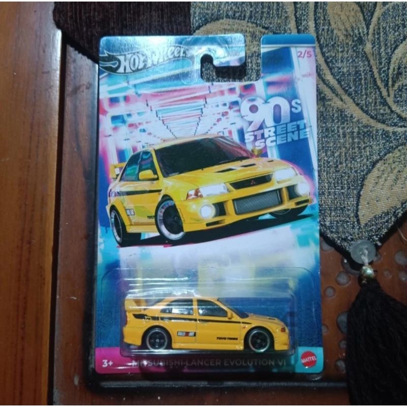 Hot wheels Mitsubishi lancer evolution VI 90s street scene yellow ...