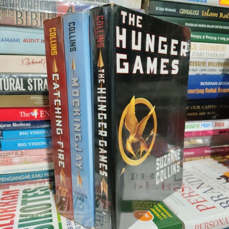 The HUNGER GAMES TRILOGY; BOOK 1 THE HUNGER GAMES • BOOK 2 CATCHING ...