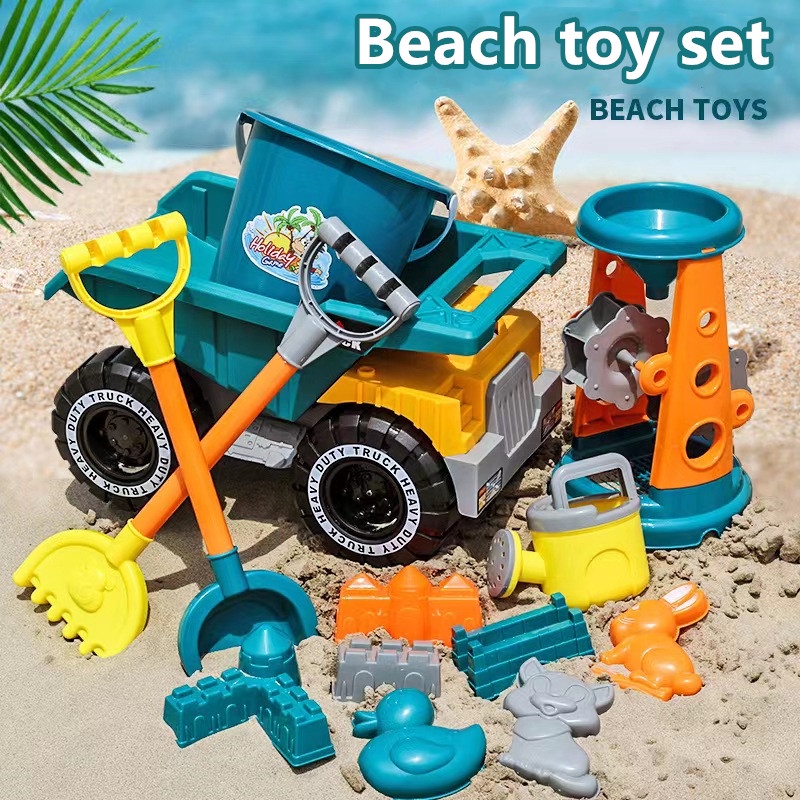 Children's beach toy car playing with water and digging sand castle ...