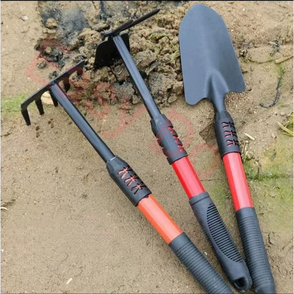 Garden tools with black plastic handle sprayed with plastic two busy ...