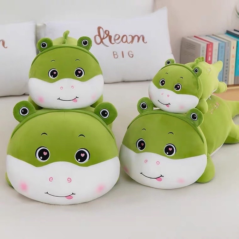 Bear holding a dinosaur turning into a green frog, bear hugging for all ...