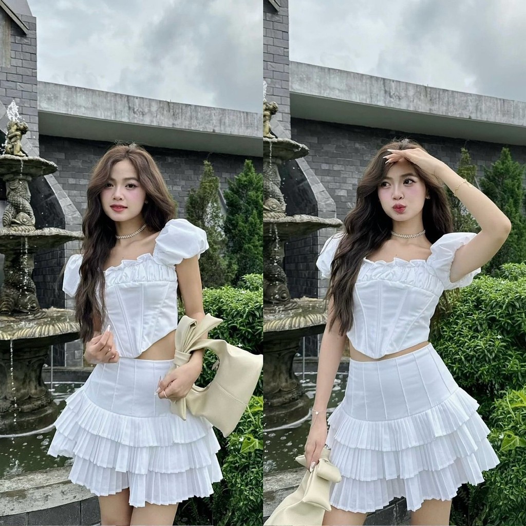 Set of bustier top with puffy sleeves mixed with layered pleated skirt ...