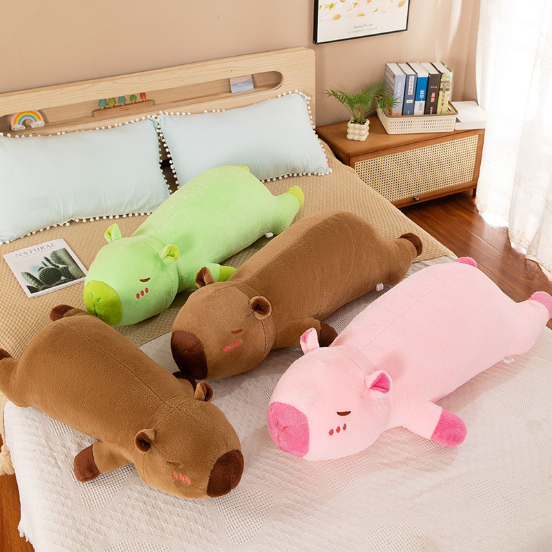 Pink/green prone style capybara pillow for girls sleeping on the bed ...