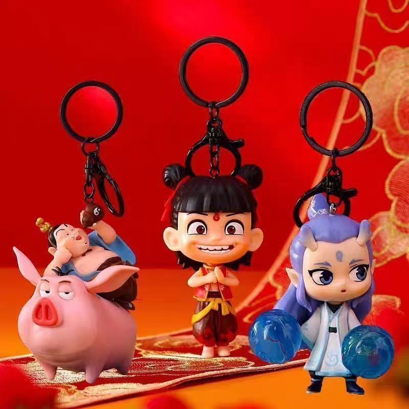 Nezha keychain flying pig around the doll keychain pendant desktop ...