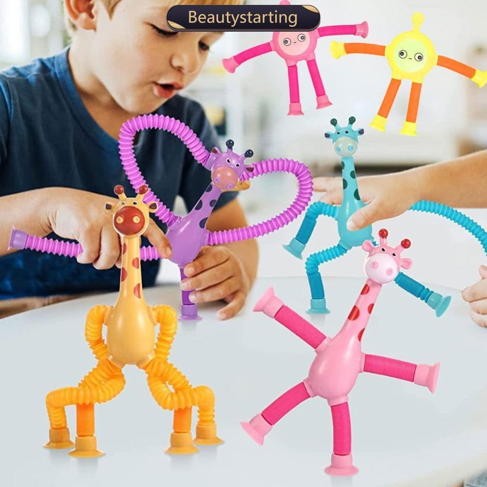 BEAUTYSTARTING Children Suction Cup Giraffe Toys Pop Tubes Robot Toy ...