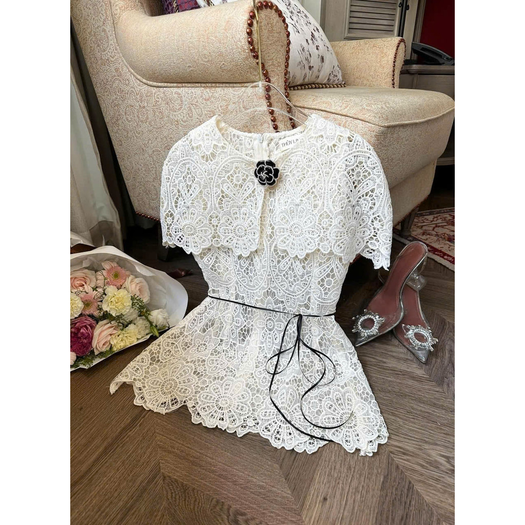 Cream lace top that hugs the waist and flatters the figure and covers ...