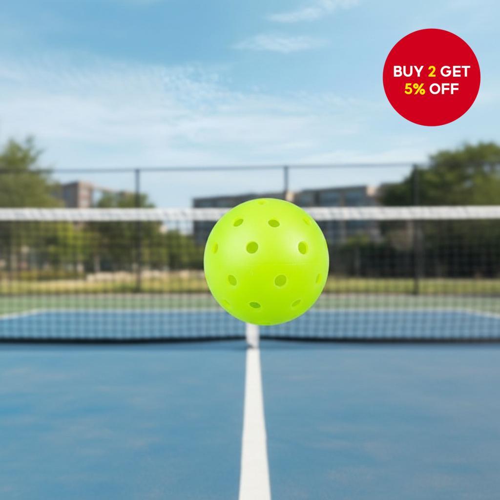 A roll-molded competition pickleball featuring a built-in hole design ...