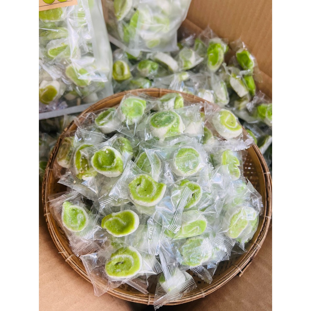 Mini rolled young coconut candy with pandan leaf flavor and traditional ...