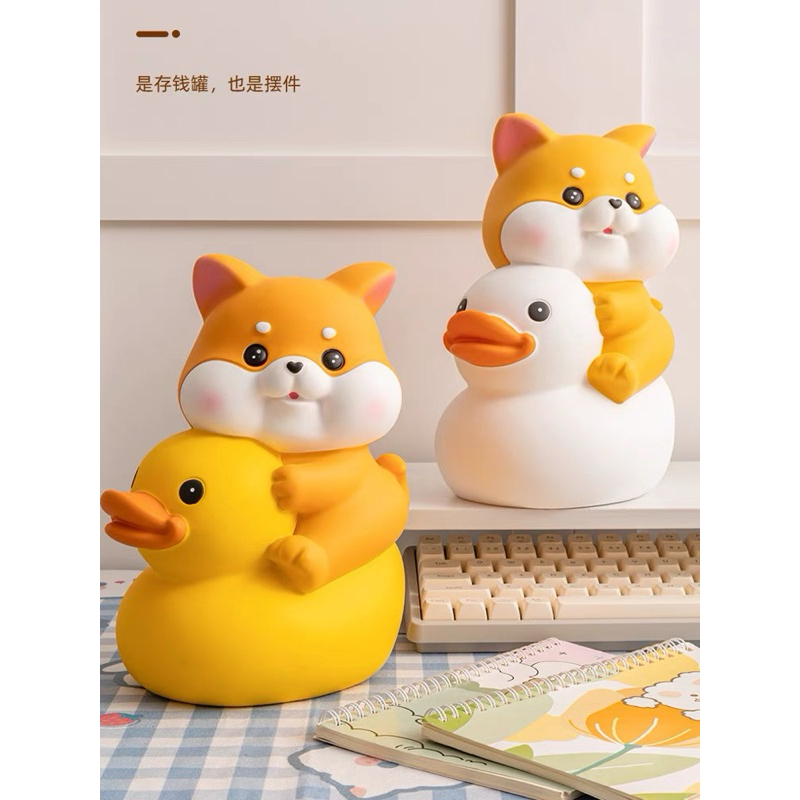 Colored plaster statue of Dog Holding a Duck (color not included ...