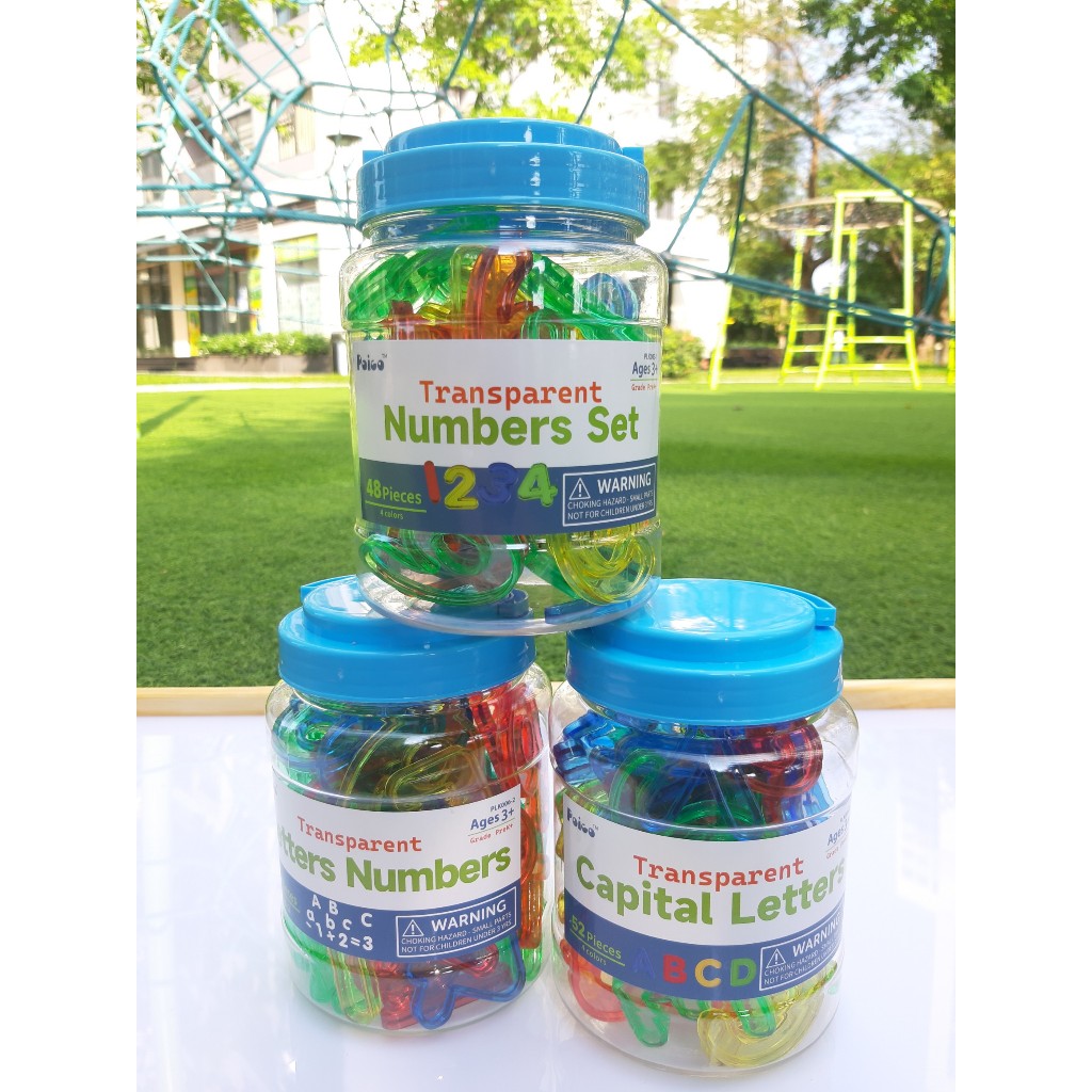 Transparent box of letters and numbers for children to learn - light ...