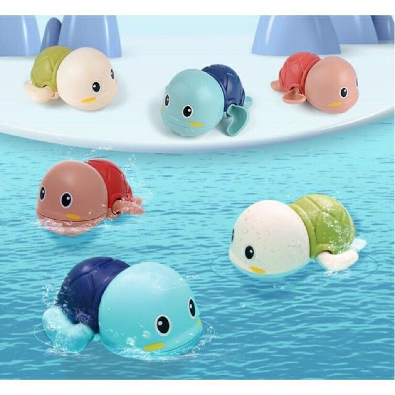 Turtle toys swimming in water, wind-up swimming turtles, animals in the ...