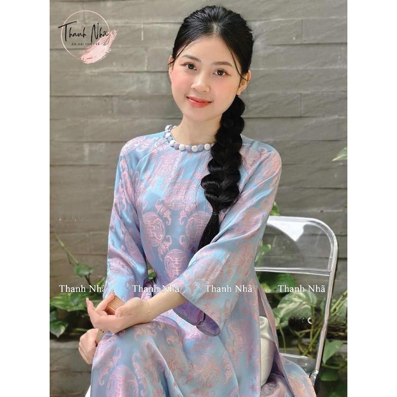 Renovated ao dai with a loose shape and unique pearl-embellished Tho ...