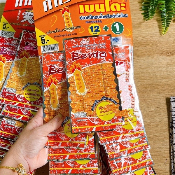 Small package of dried squid seasoned with Thai Bento spices, 4g ...