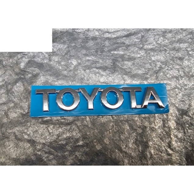 Toyota embossed lettering (matte color) is stuck on the back of Toyota ...