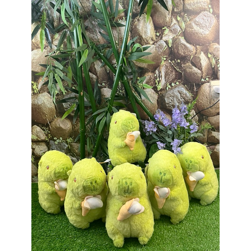 Green capybara teddy bear toy holding banana | Shopee Malaysia