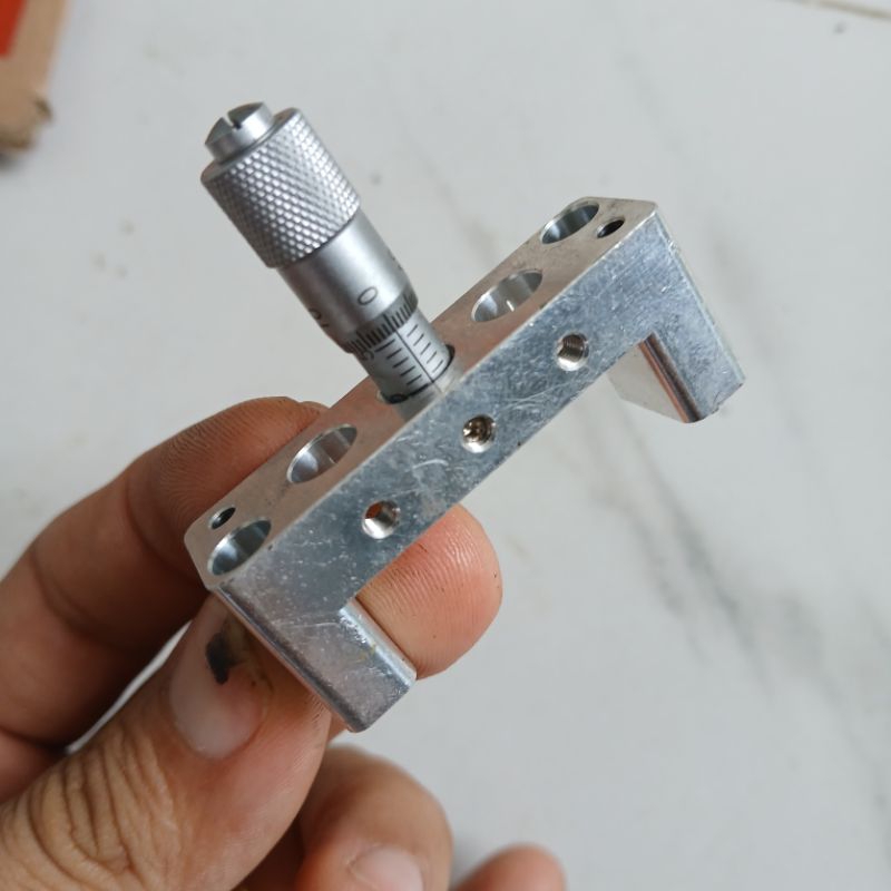 Small micrometer with aluminum base to align and press small items to ...