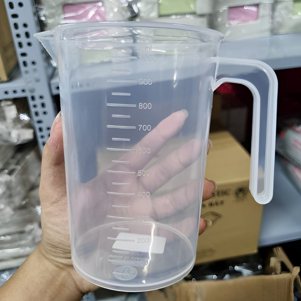 Measuring cups 1 liter, 2 liters, 3 liters measuring the volume of the ...