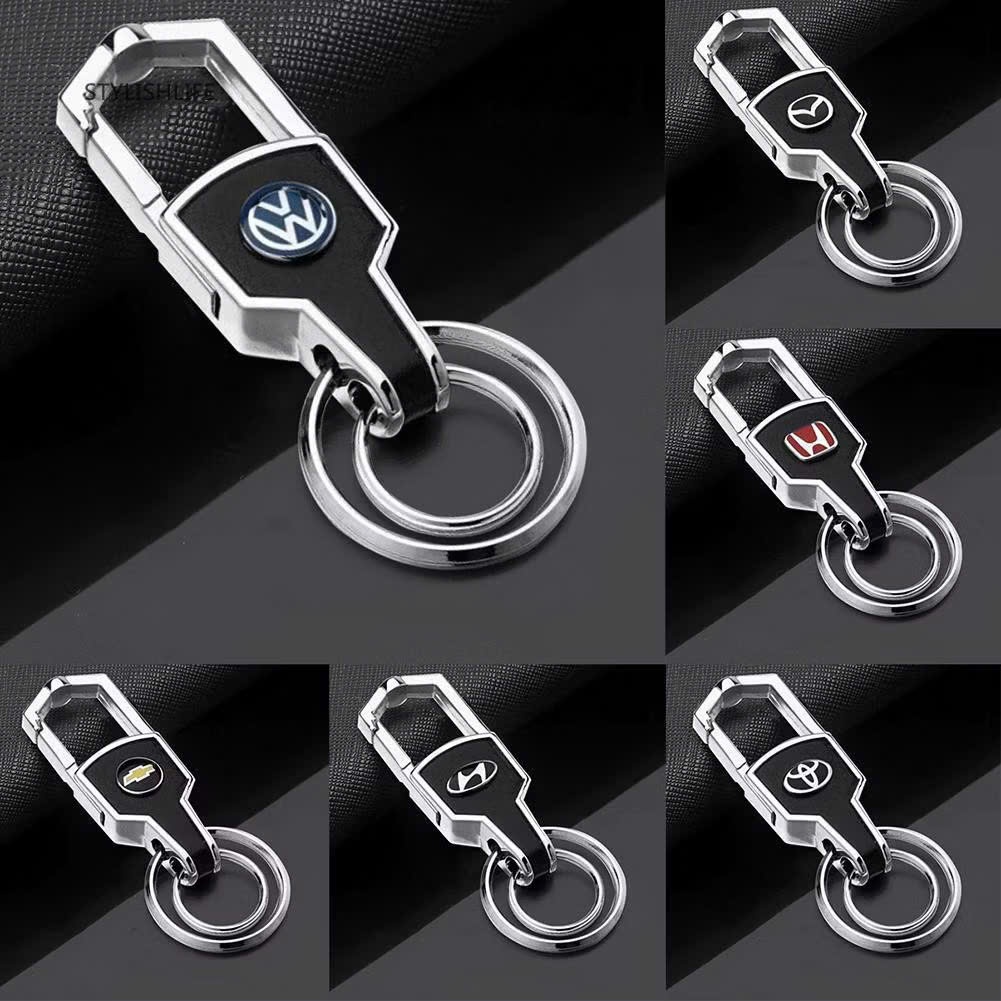 Leather-wrapped car and car keychains with logos of all brands, made of ...