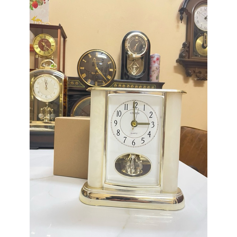 Citizen rotating desk clock with two stone pillars on both sides ...