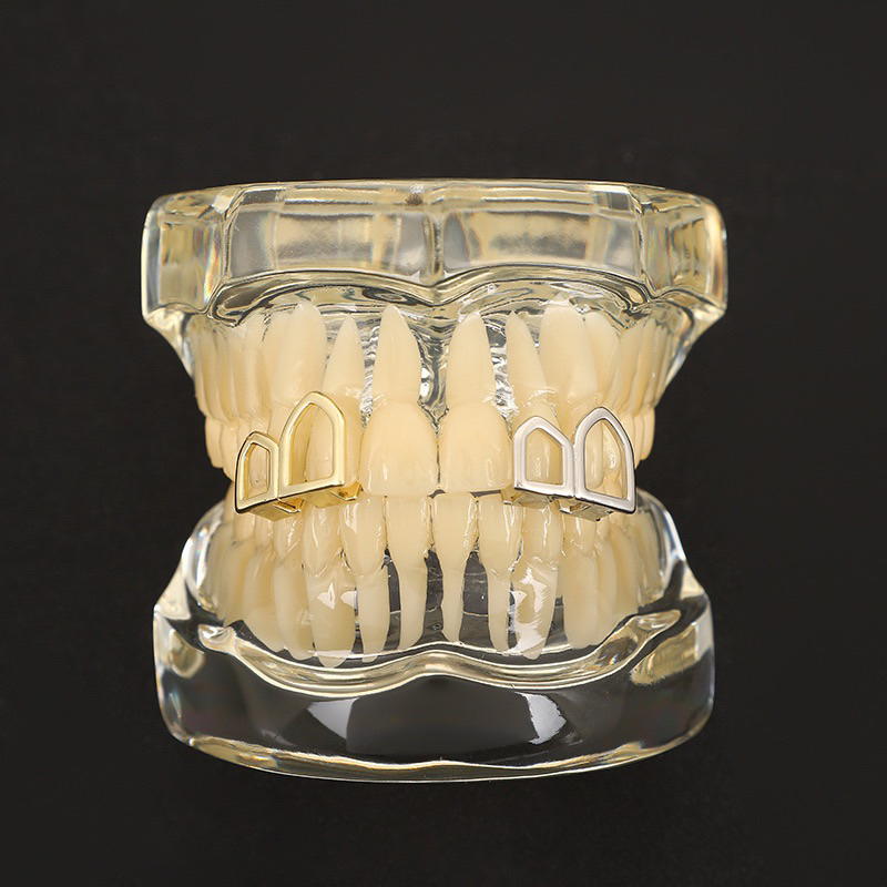 Grillz jewelry with 2 side teeth, gold and silver tooth rim design ...