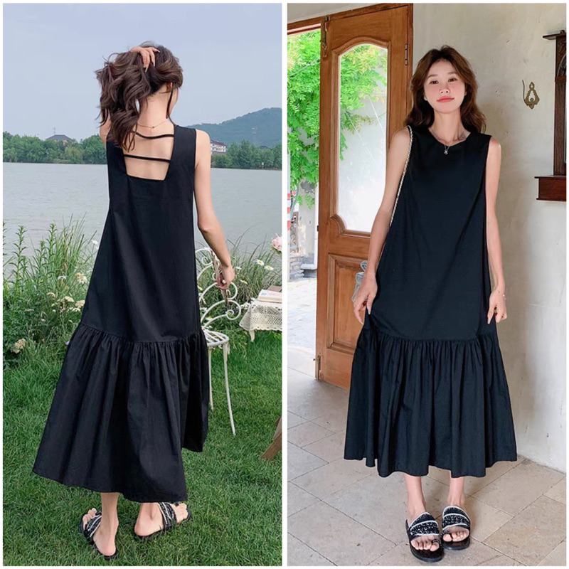 Slim black fishtail dress with straps at the waist that can be worn by ...