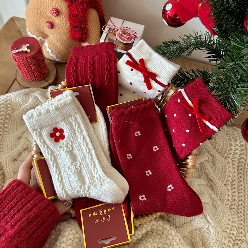 Red Christmas socks embroidered with bows and flowers, youthful and ...