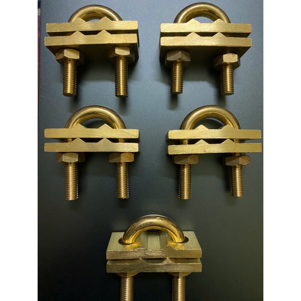 Brass U-shaped cable clamp. Pile clamp and cable (Thick, shiny, strong ...
