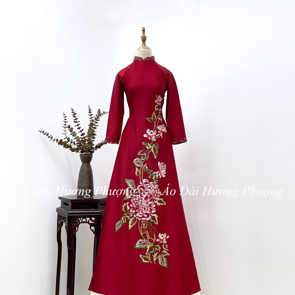 Traditional Huong Phuong Ao Dai made of high-quality Queen silk embroidered with beautiful and ...