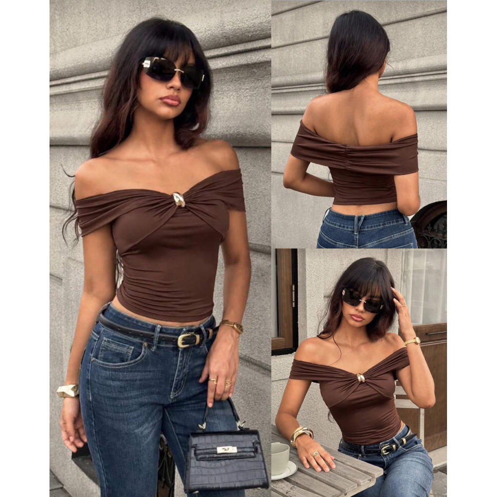Fashionable off-the-shoulder shirt, with gold tag on the chest (Brand ...