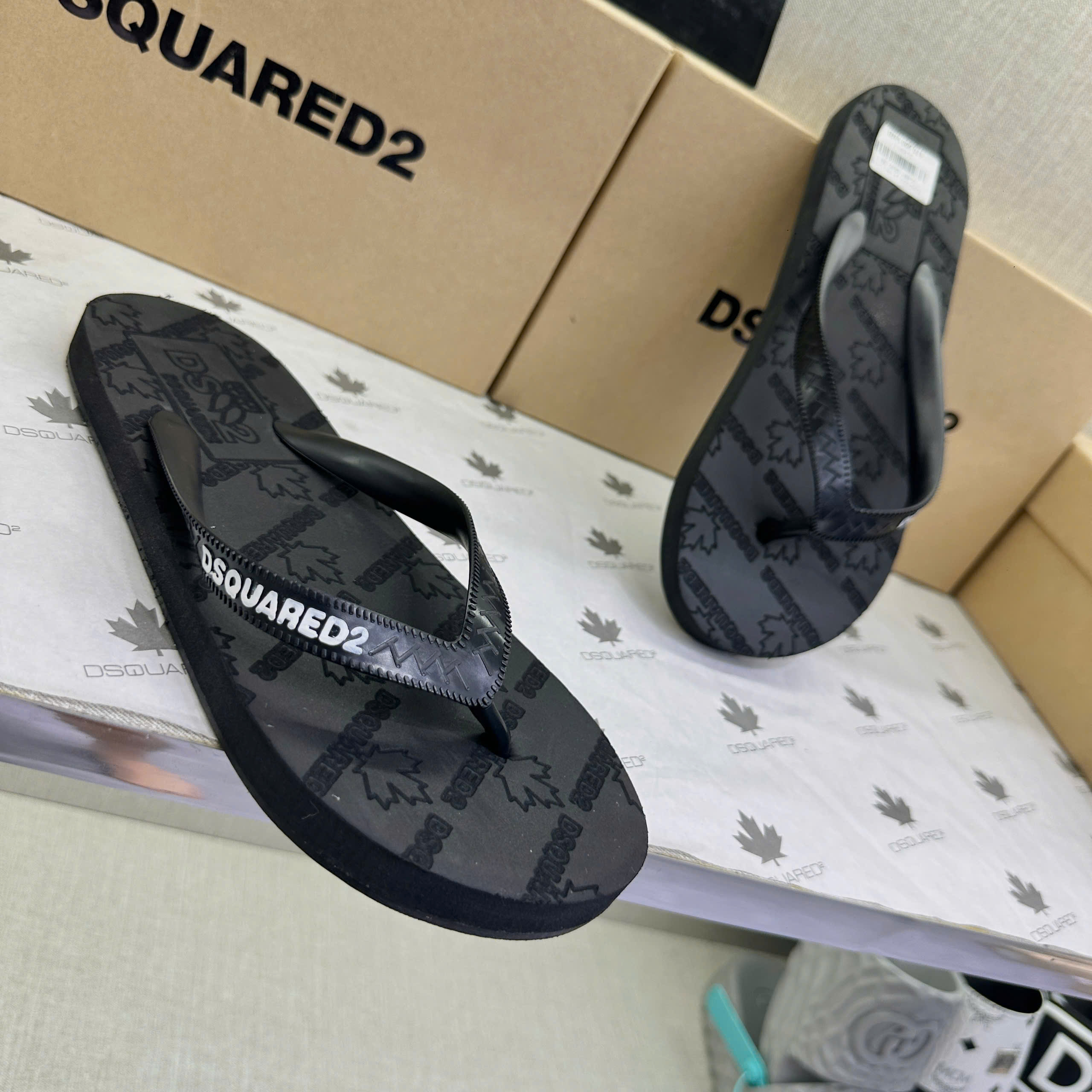 Dsq men's and women's flip-flops with foam rubber sole embossed with ...