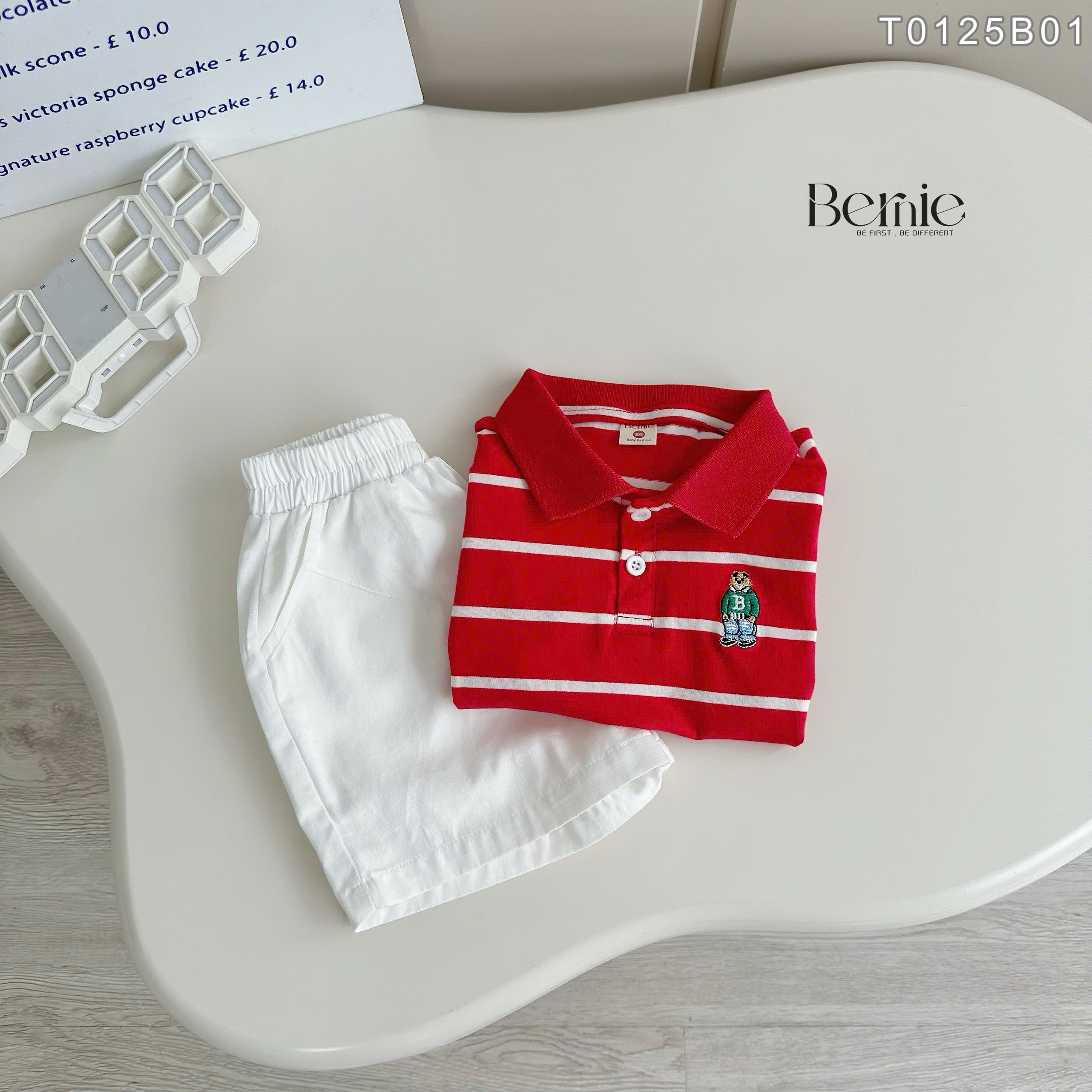Short-sleeved striped polo Set with embroidered hem and white shorts ...